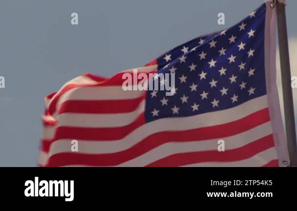 American Flag Waving Slow Motion. Large American Flag flies. US flag ...