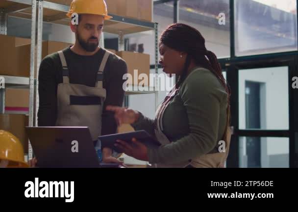 Professionals doing warehouse inventory monitoring, keeping quality ...