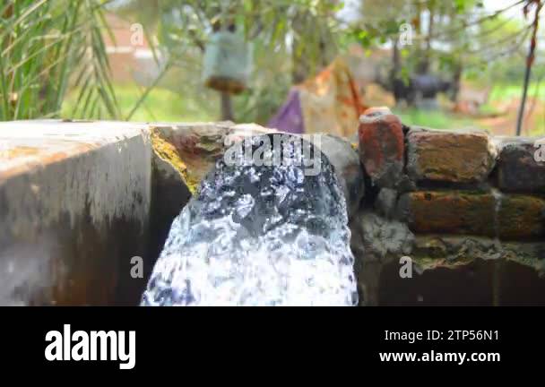 FHD footage of water coming out from tube well pipe. Concept of ...