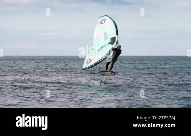 Modern water sport. Hydrofoil ride on the ocean using the wing and the ...