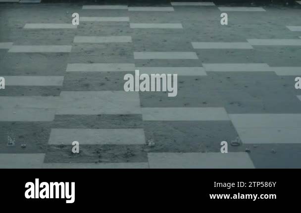 Heavy rain drops falling on city asphalt floor tiles during a heavy ...