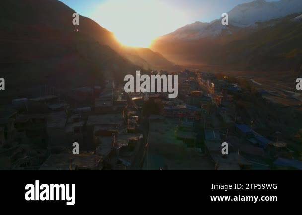 Aerial circular view manang village rooftops with stupa in center. in ...