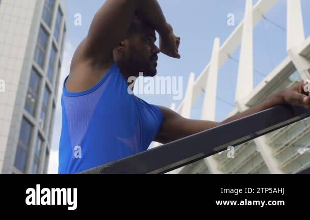 Muscular guy tired of running, sweating and breathing hard, development ...