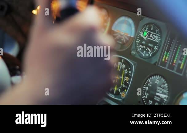 Pilot hands on steering wheel of private airplane, indicators on flight ...