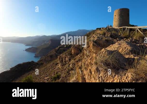 Mediterranean coastal landscape. Historic Torre Vigia De Cerro Gordo, a ...