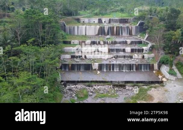Aerial footage of the Watu Purbo sabo dam in Sleman, Indonesia which ...