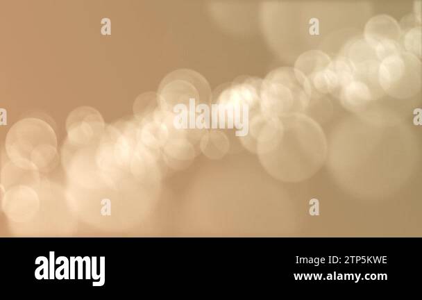 Defocused golden bokeh lights background. This elegant motion background animation with sphere ...