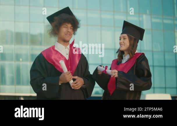 Happy and Successful Graduates in the Mantle and Cap Giving High Five ...