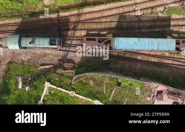 The camera moves from top to bottom. The locomotive is attached to the ...