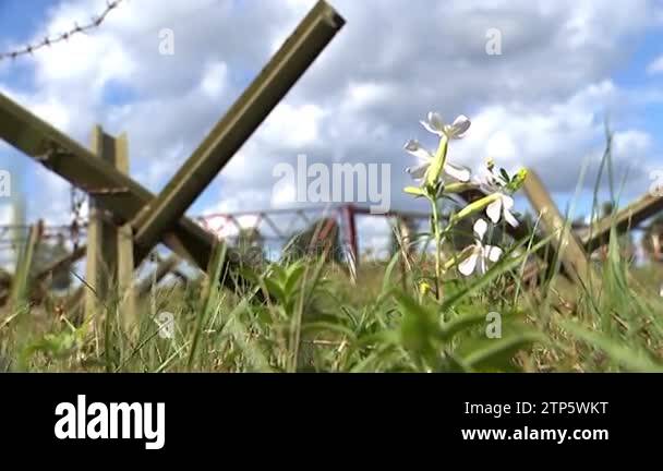 Anti-tank obstacles are installed on the paved road, barriers for the ...