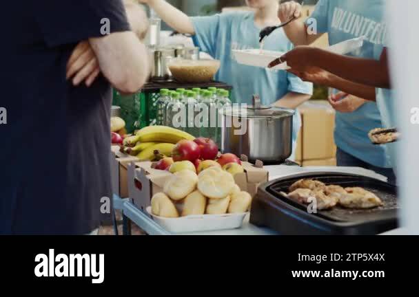 Multiracial team that fights hunger distributes free meals to the poor ...