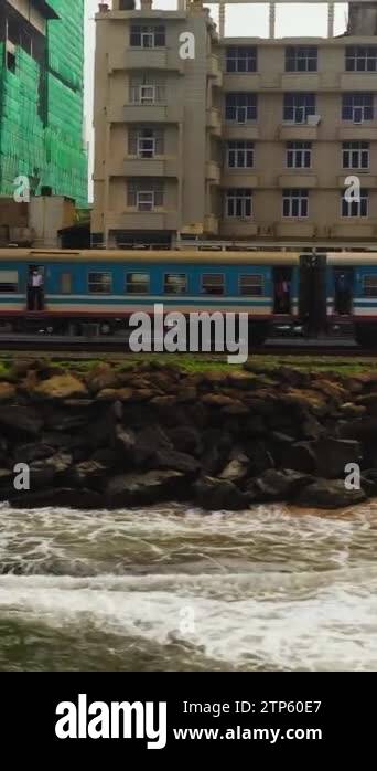 A train on the coastal railway in Colombo, Sri Lanka Stock Video ...