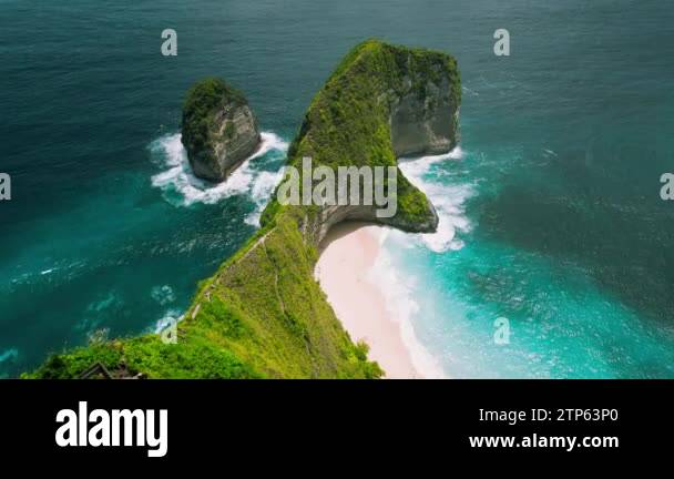 Tropical pristine sandy beach and green forest on ocean coastline with ...