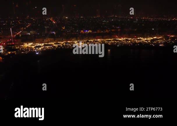 Fantastic nighttime skyline with illuminated skyscrapers. Elevated view ...