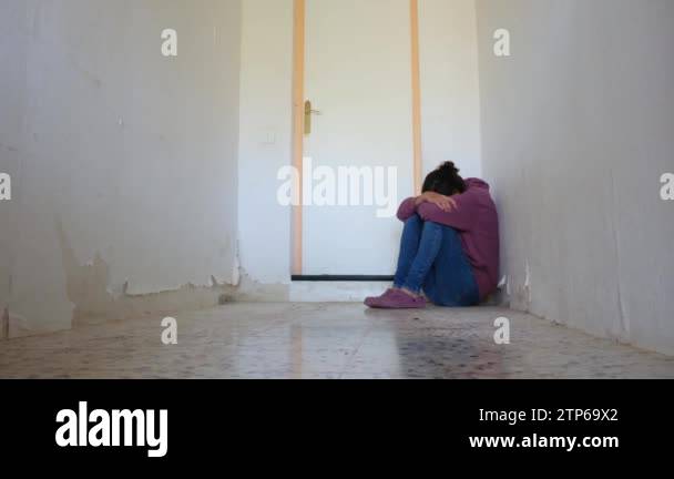 Consequences of domestic violence and abuse, showing a woman in the ...