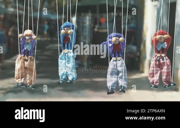 Rag dolls hang in a row on a rope Stock Video Footage - Alamy