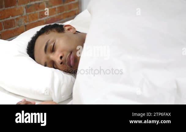 Uncomfortable African Man Sleeping in Bed at Night, Restlessness Stock ...