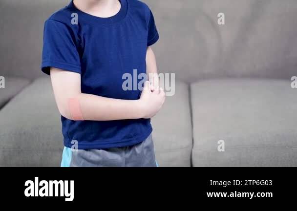 A boy with pain in his stomach rubs his stomach on the pain point Stock ...