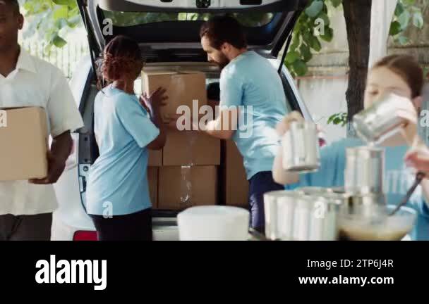 Poor, needy and homeless people are helped by charity workers at a non ...