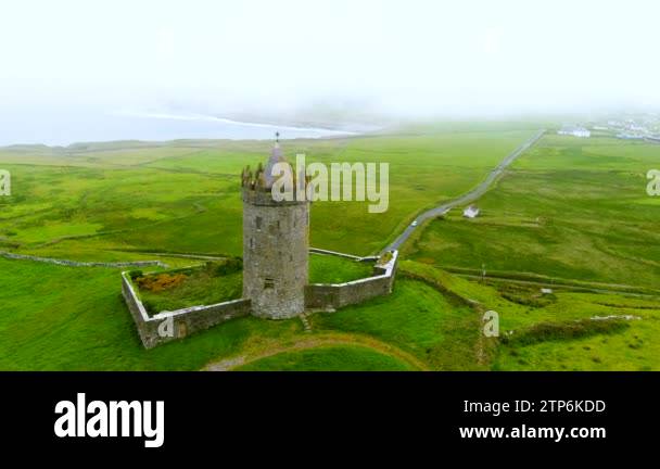 Doonagore Castle aerial foggy view, iconic landmark, one of the most ...