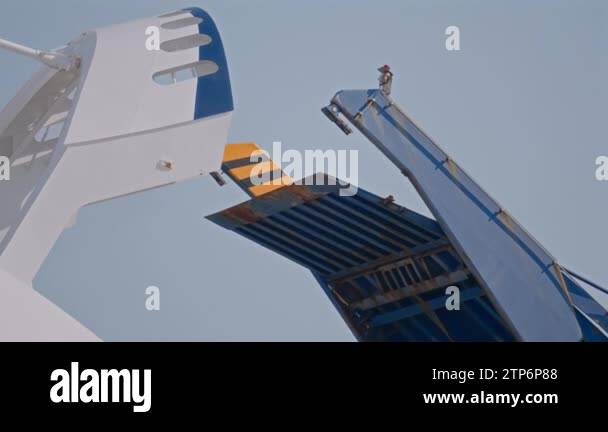 The ferry ramp gracefully closes, securing the vessel for its upcoming ...