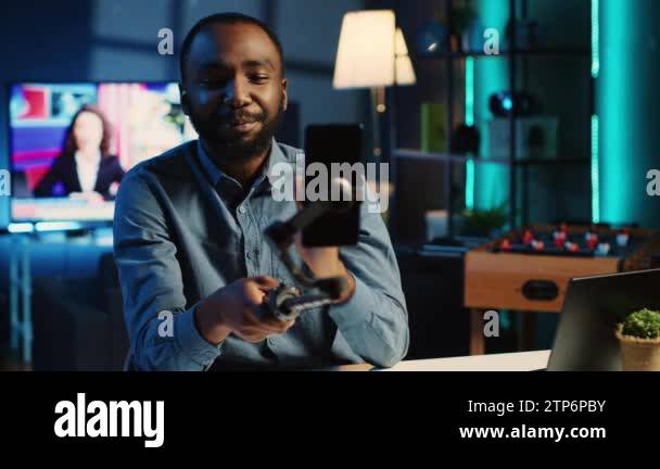 Content creator using selfie stick for smartphone, doing live broadcast ...