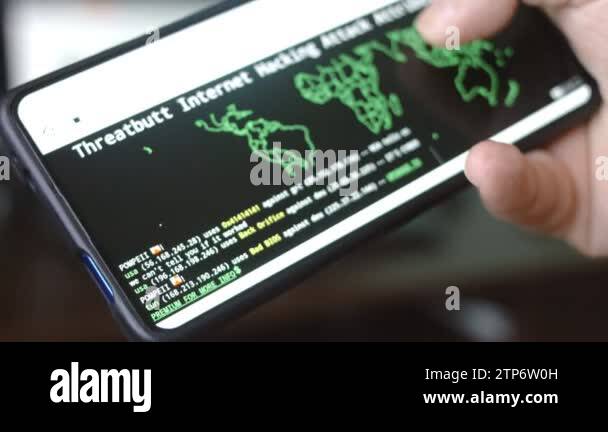 Cyber attack map navigation on smartphone. Displays Show Various Technical Information. Hes ...