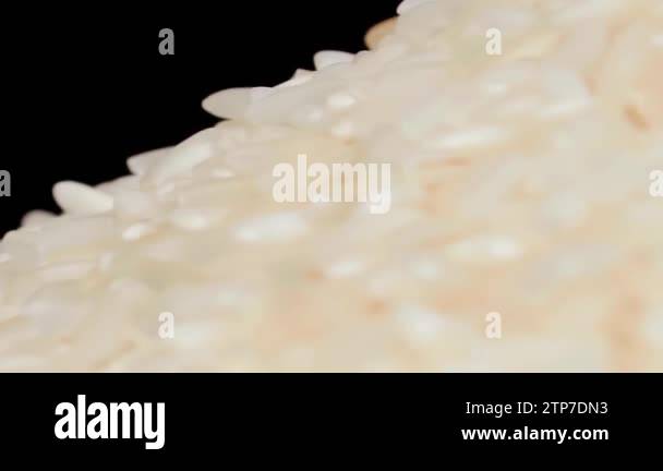 Dry Uncooked White Rice Heap Rotating - Macro. A Pile of Raw Long Grain ...
