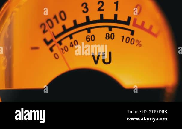 Analog dial indicator of audio signal level. Vintage arrow moves in ...