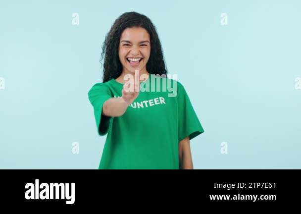 Volunteer, woman with thumbs up and face, help and activism with ...