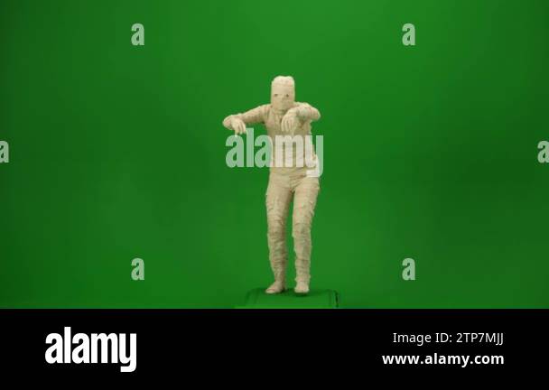 Green screen isolated chroma key video capturing a mummy staggering ...