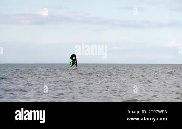 Modern water sport. Hydrofoil ride on the ocean using the wing and the ...