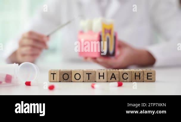 Dentist places dental implant and writes prescription for tablets for ...