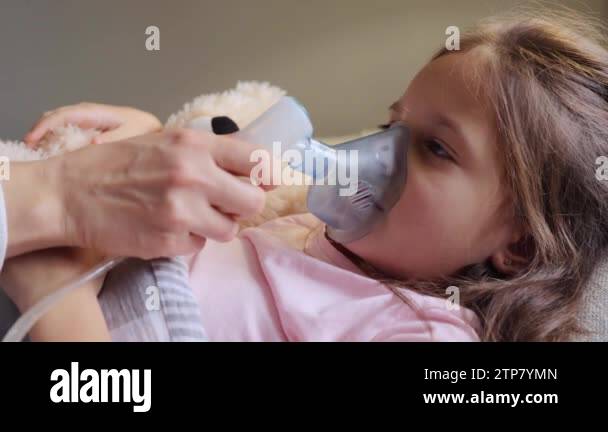 Nebulizer therapy at home. Pediatric medical treatment. Inhalation for ...