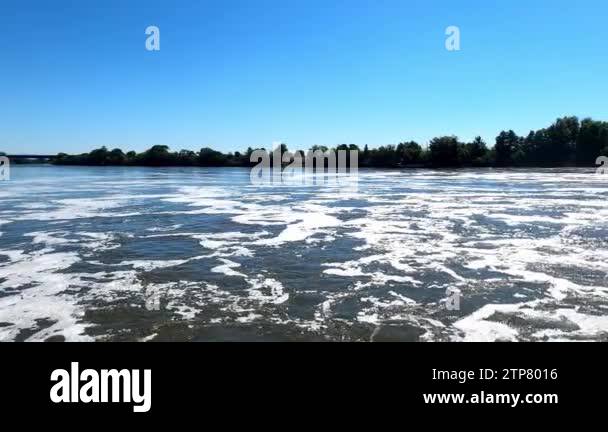 Strong current in the Danube river after opening the overflow at a lock ...
