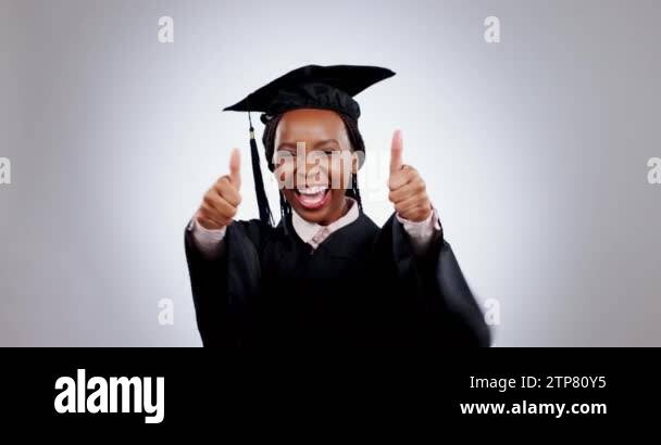 Happy black woman, graduation and thumbs up in winning, success or ...
