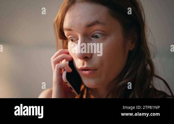 Stressed girl talking cell in sunlight closeup. Worried young woman ...
