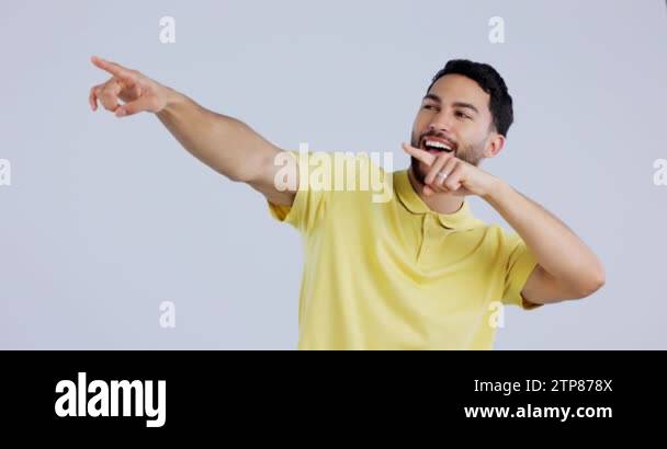 Excited, mockup and man pointing in studio isolated on a white ...