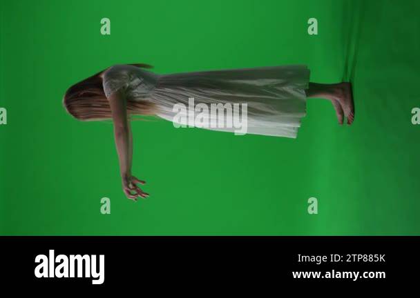 Full-size vertical side view green screen, chroma key video of a ...