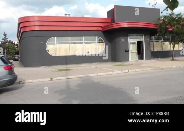 empty vacant restaurant store storefront with windows covered from ...