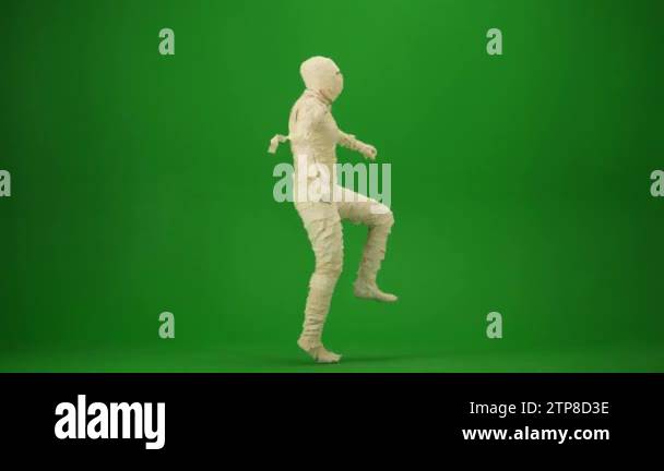 A mummy wrapped in bandages dancing, waving hands and legs. Green ...