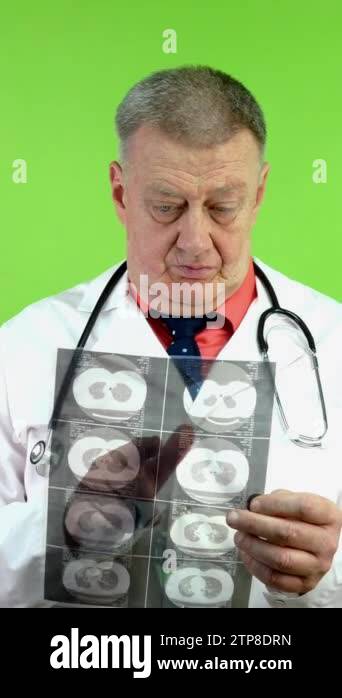 Senior doctor in white coat showing positive examination results X-ray ...