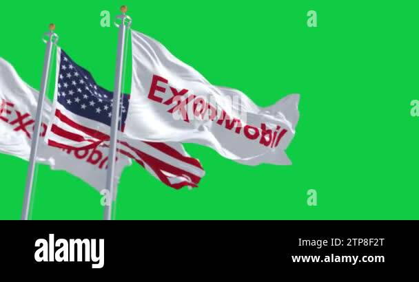 Spring, US, Oct. 5 2023: ExxonMobil and American flags waving on green ...