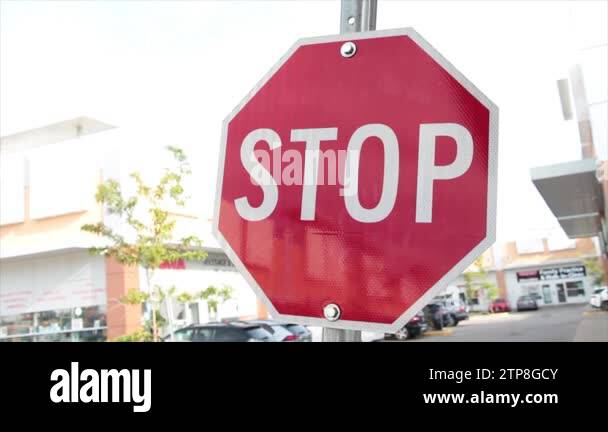 small mini miniature stop sign on metal post outside outdoors in mall ...