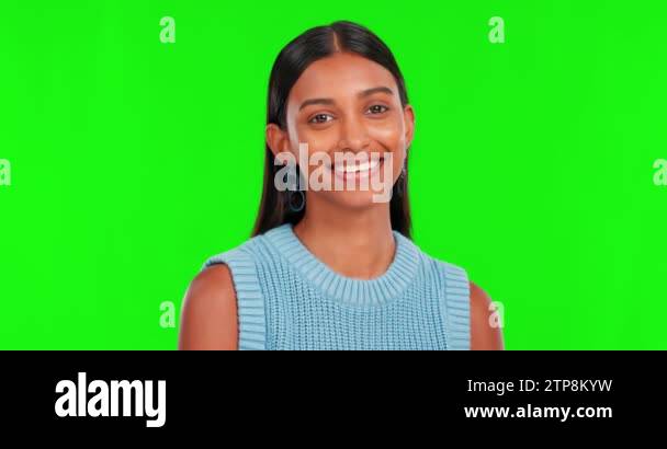 Face, smile and Indian woman in green screen studio laughing, joke or ...