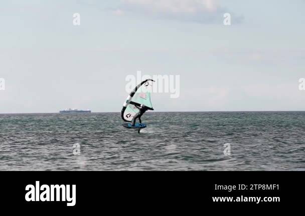 Modern water sport. Hydrofoil ride on the ocean using the wing and the ...