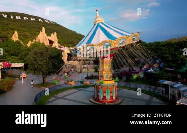 Illuminated merry go round carousel filmed at night in amusement park Stock Video Footage - Alamy