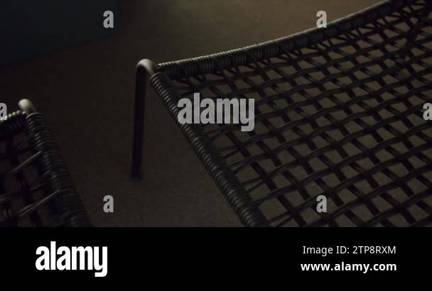 Closeup on metal chair with woven seat and modern design. Detail of ...