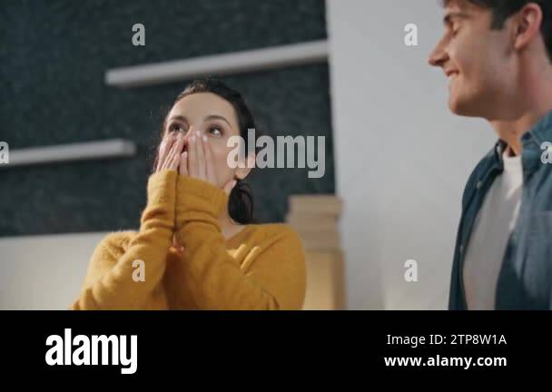 Wife rejoicing new home clapping hands hugging happy husband close up ...