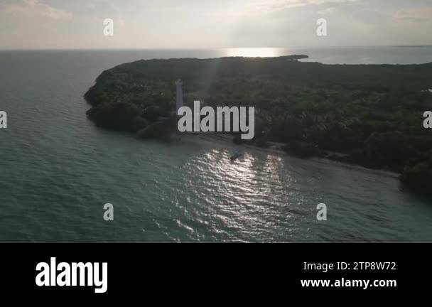 drone approaching punta allen lighthouse in Tulum biosphere Sian Kaan ...